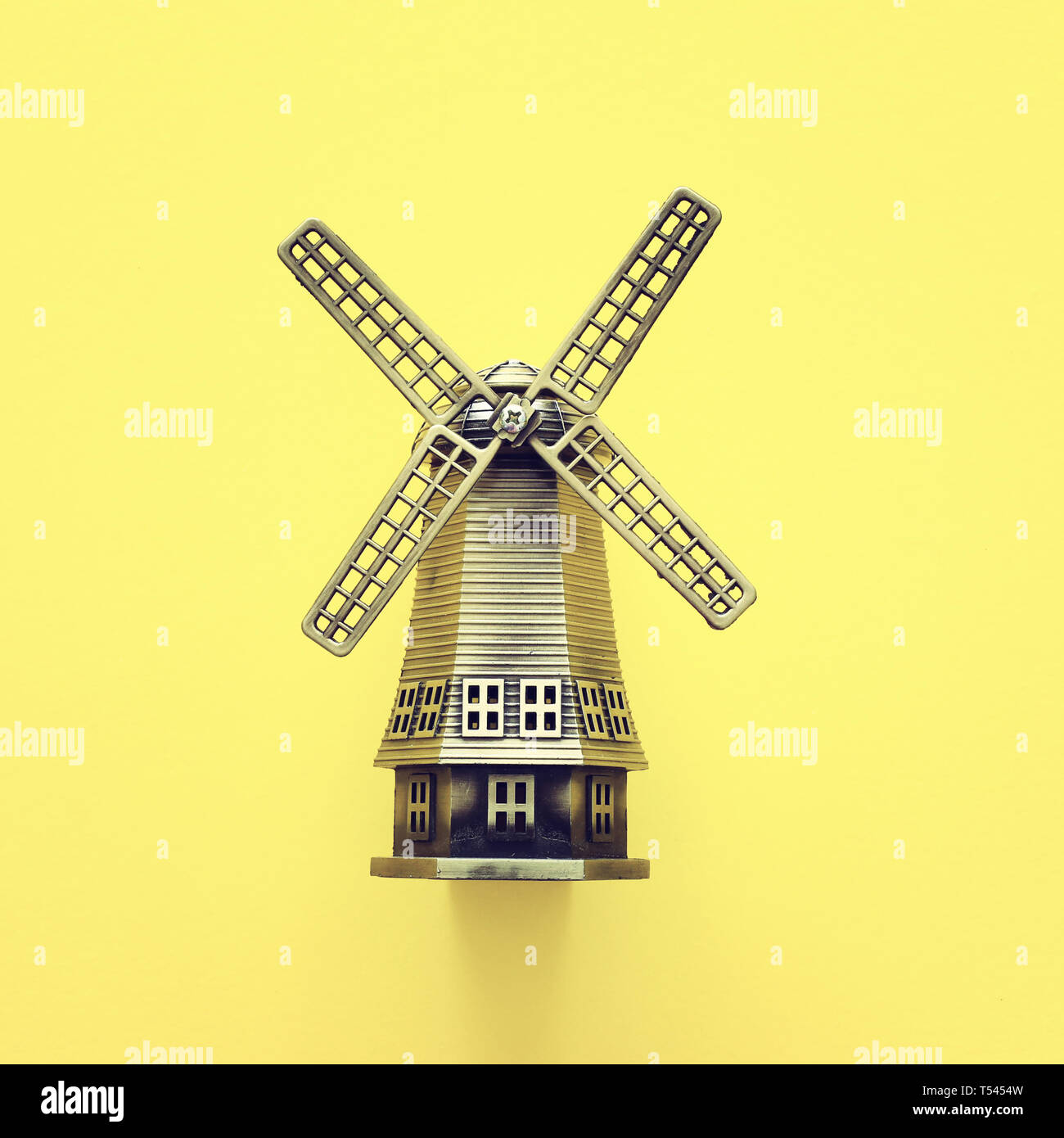 Traditional dutch windmill over yellow background Stock Photo - Alamy
