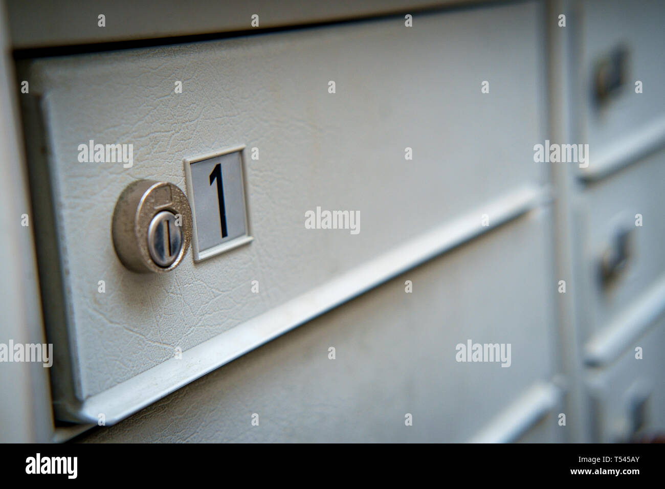 Old worn apartment mail boxes with numbers and keys Stock Photo - Alamy