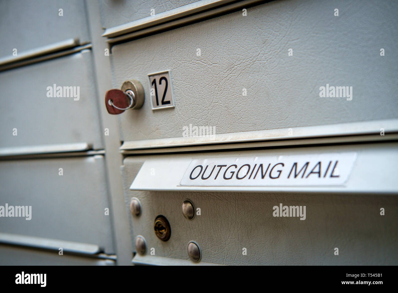 Old worn apartment mail boxes with numbers and keys Stock Photo - Alamy