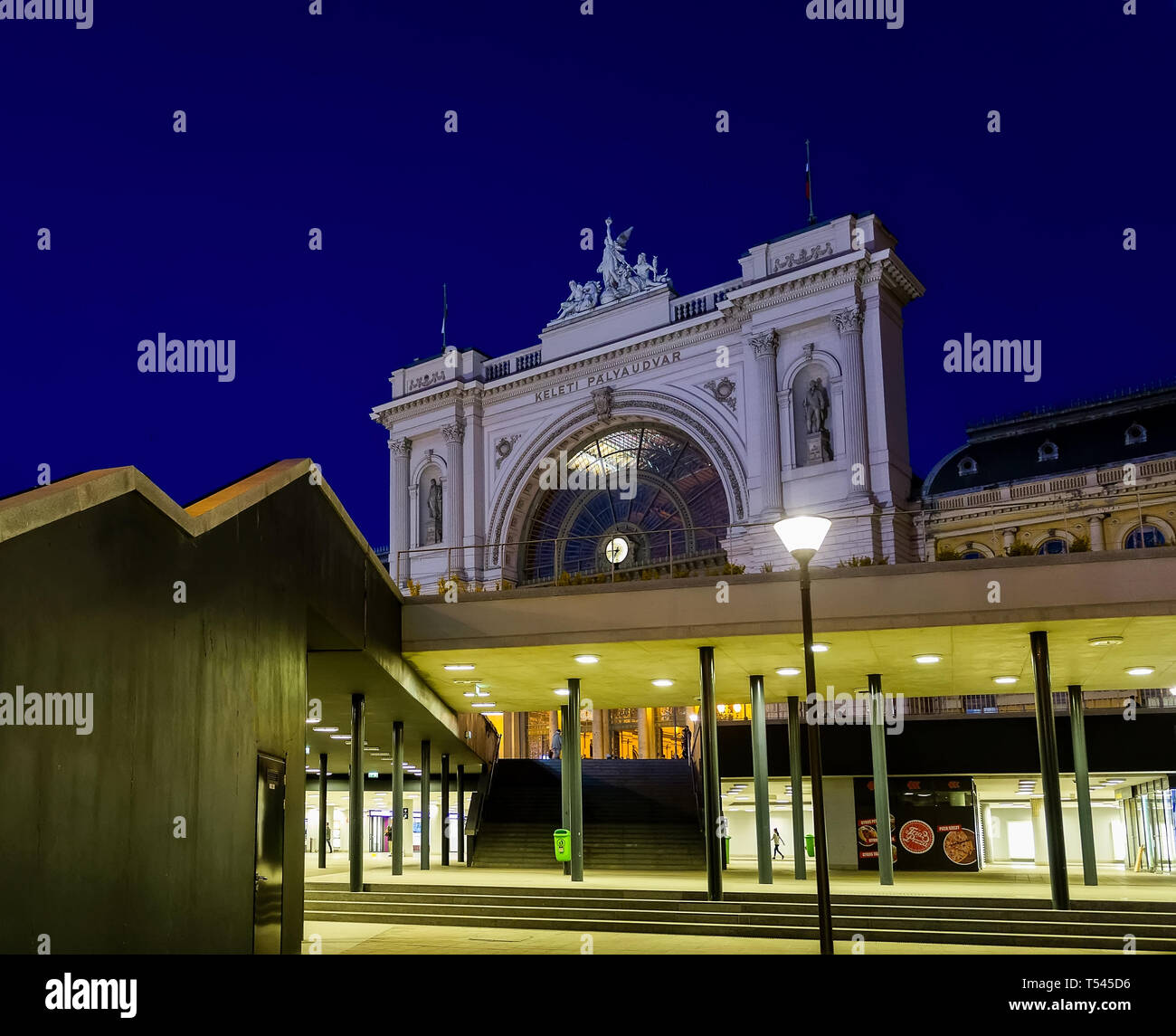 Facade of Keleti railway station from underground space at night.This ...