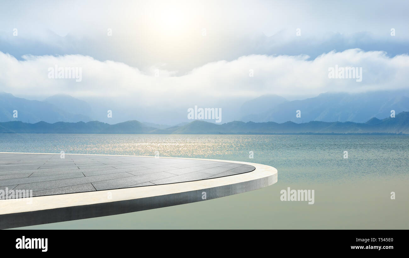Empty square platform and river with mountain landscape Stock Photo - Alamy