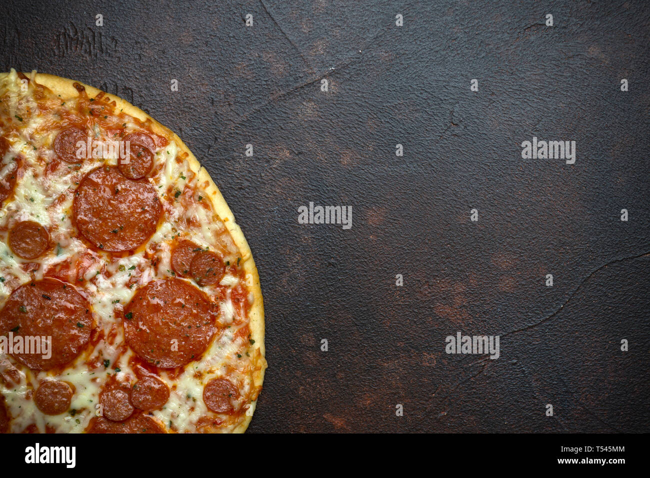 Italian pizza pepperoni on dark stone background. Pepperoni and salami ...