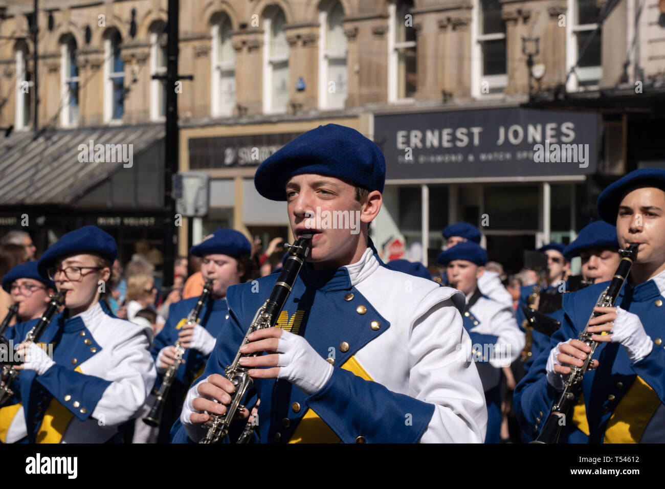 Clarinet players dressed in blue and white costumes on parade, The ...