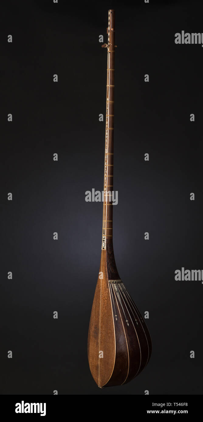 ancient Asian stringed musical instrument on black background with ...