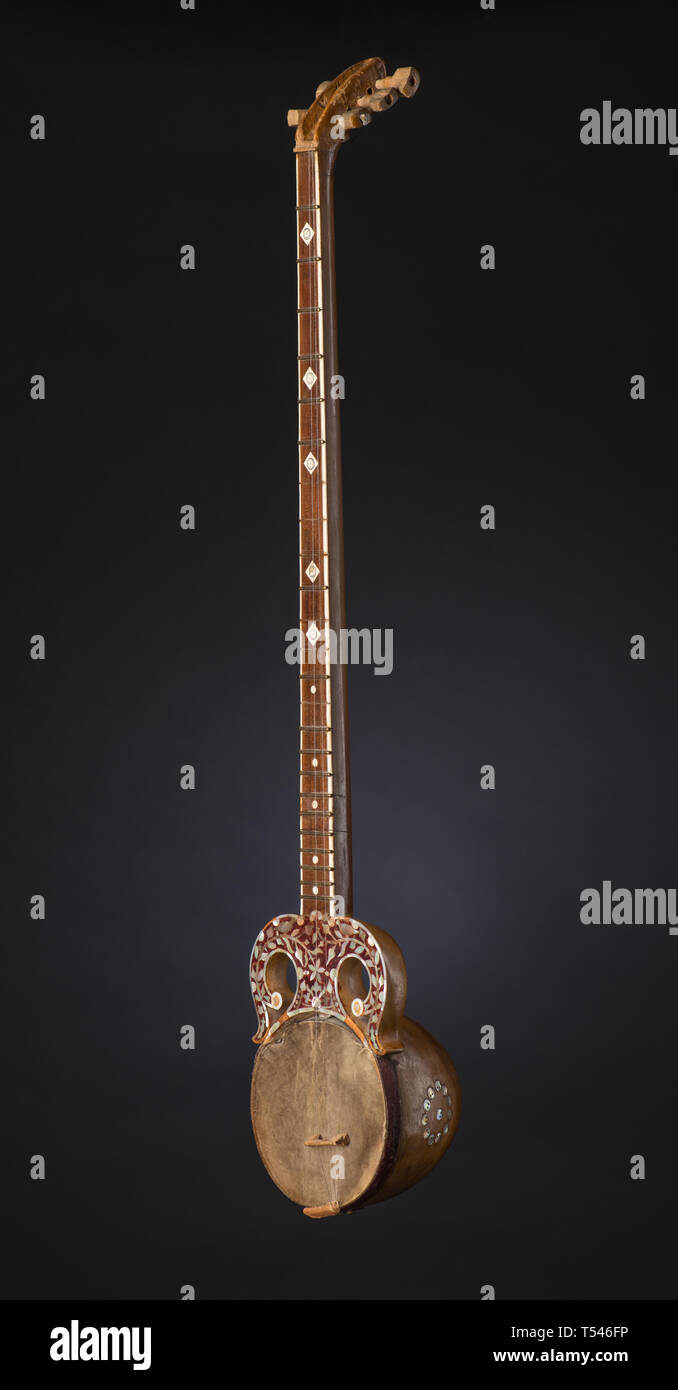 ancient Asian stringed musical instrument on black background with ...