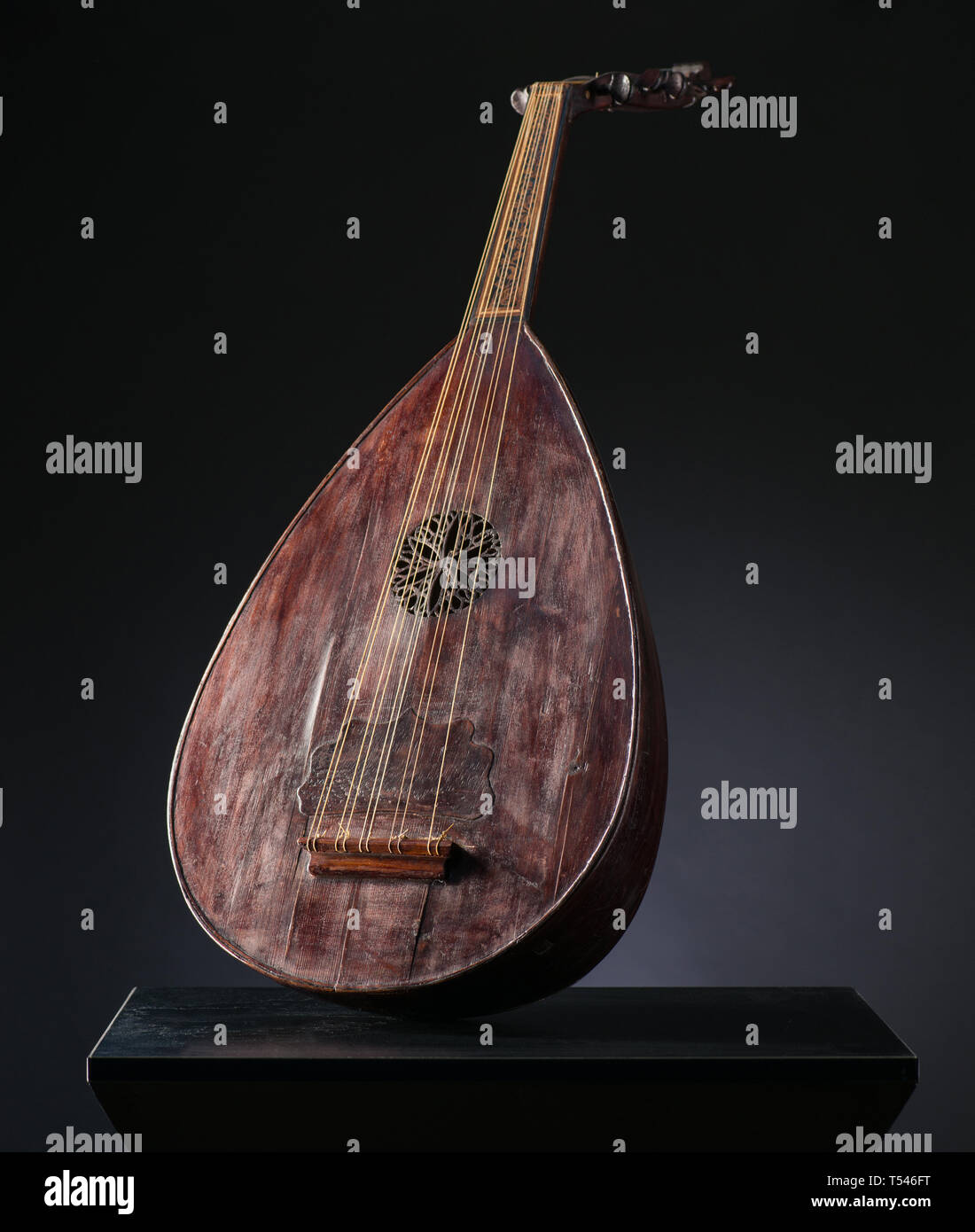 ancient Asian stringed musical instrument on black background with ...