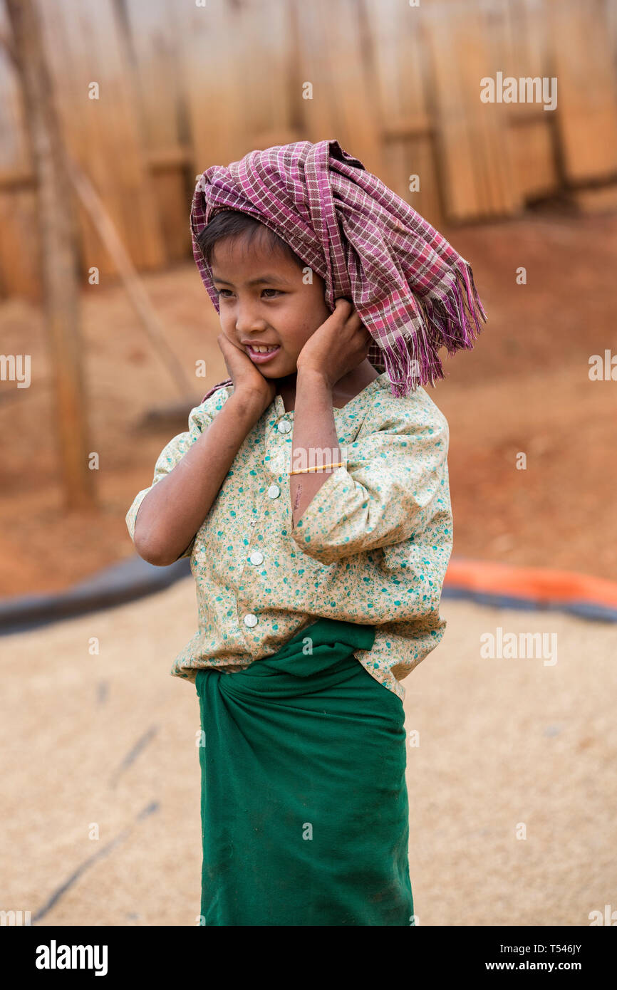 Young Shan girl in a village on the trek from Kalaw to Inle Lake, Shan ...