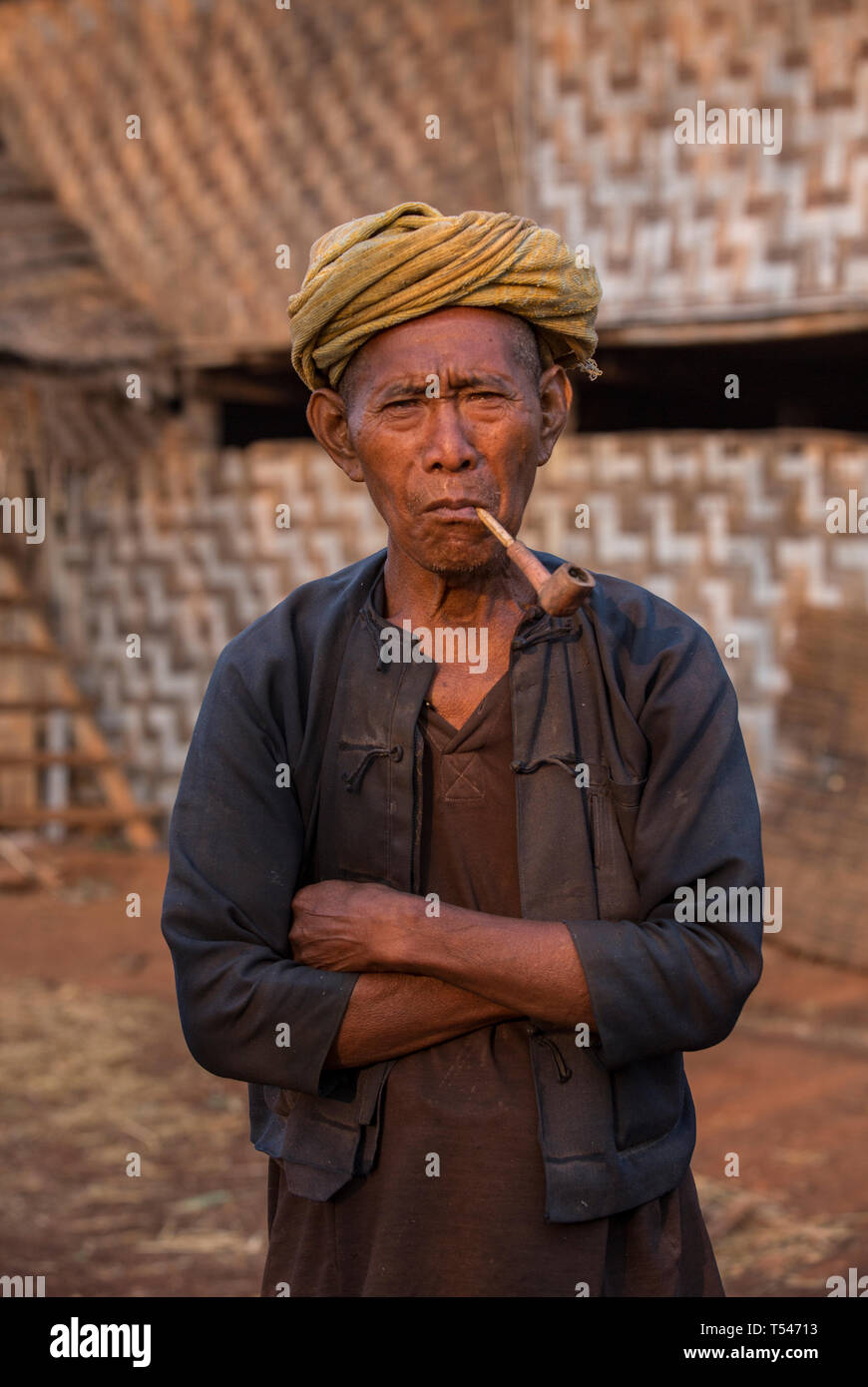 Elderly man smoking traditional pipe hi-res stock photography and ...