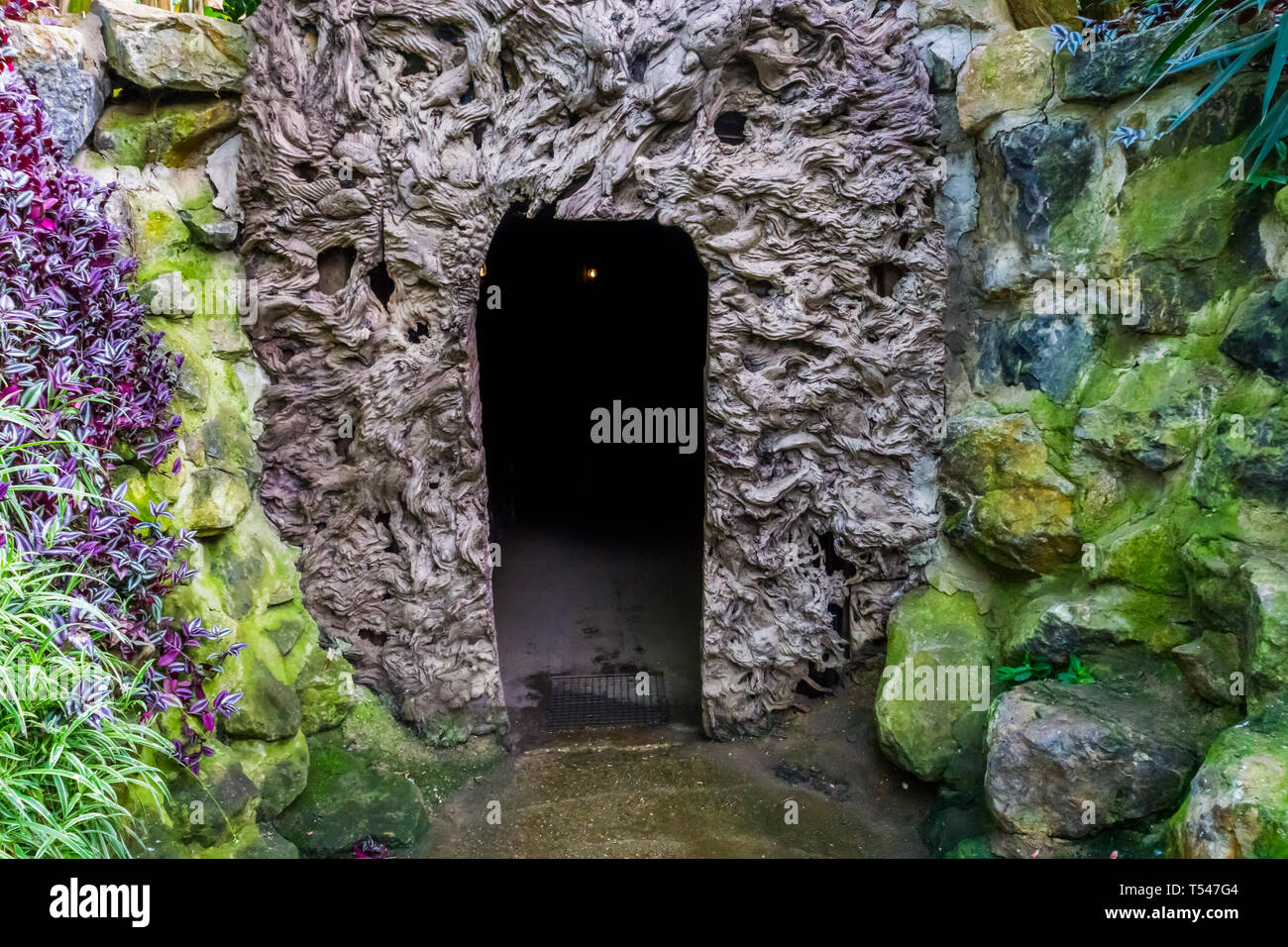 entrance of a very dark cave, halloween haunted den concept, scary ...