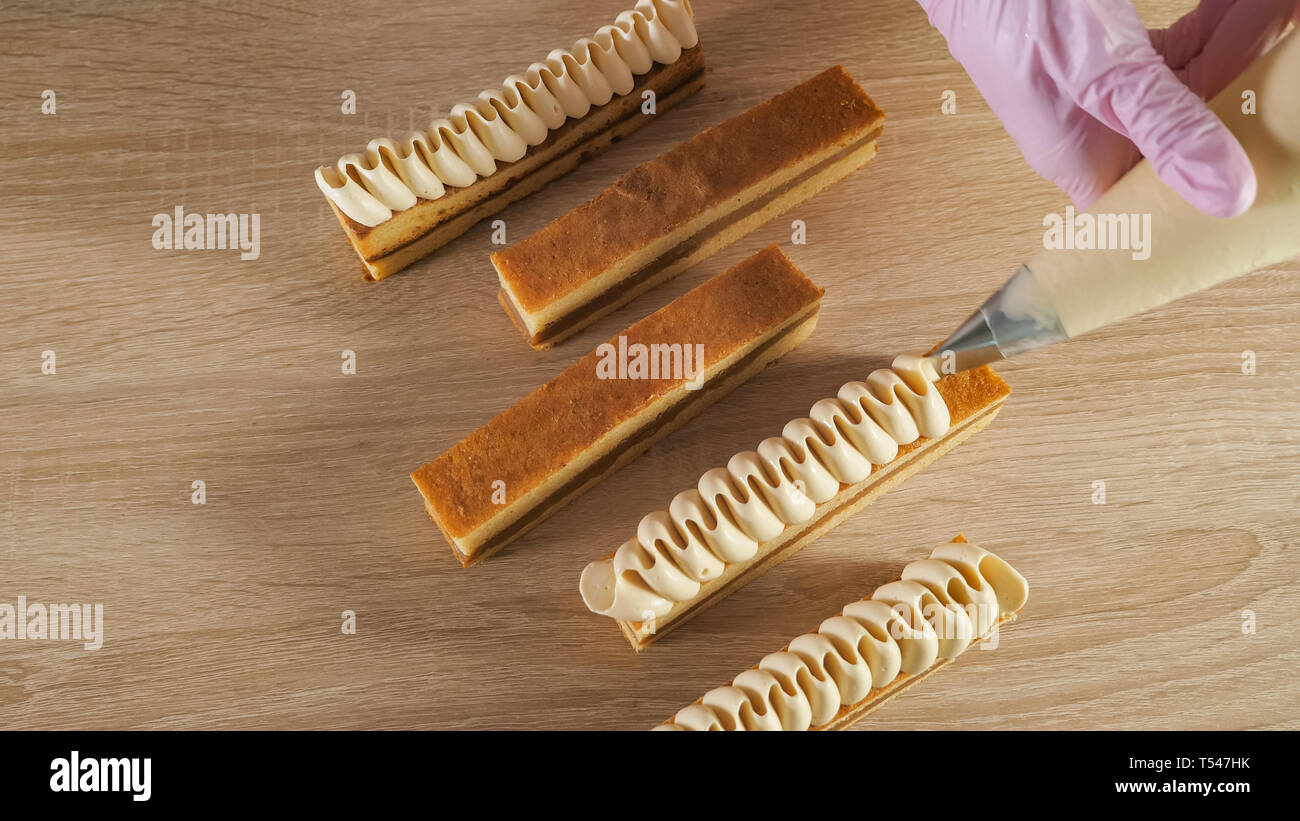 Top view confectioner hands put hi-res stock photography and images - Alamy
