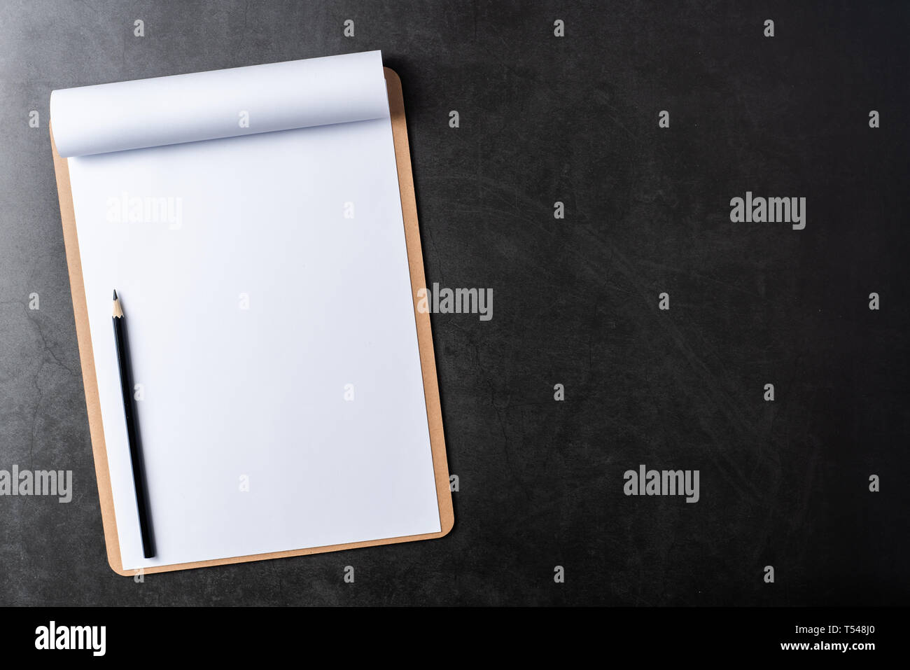 Design concept - top view of white A4 flipped paper with brown ...