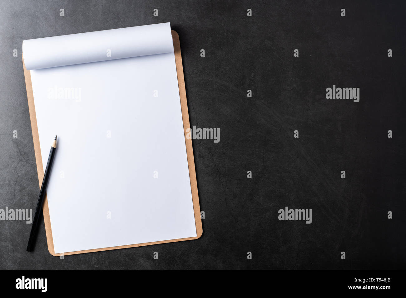 Design concept - top view of white A4 flipped paper with brown ...