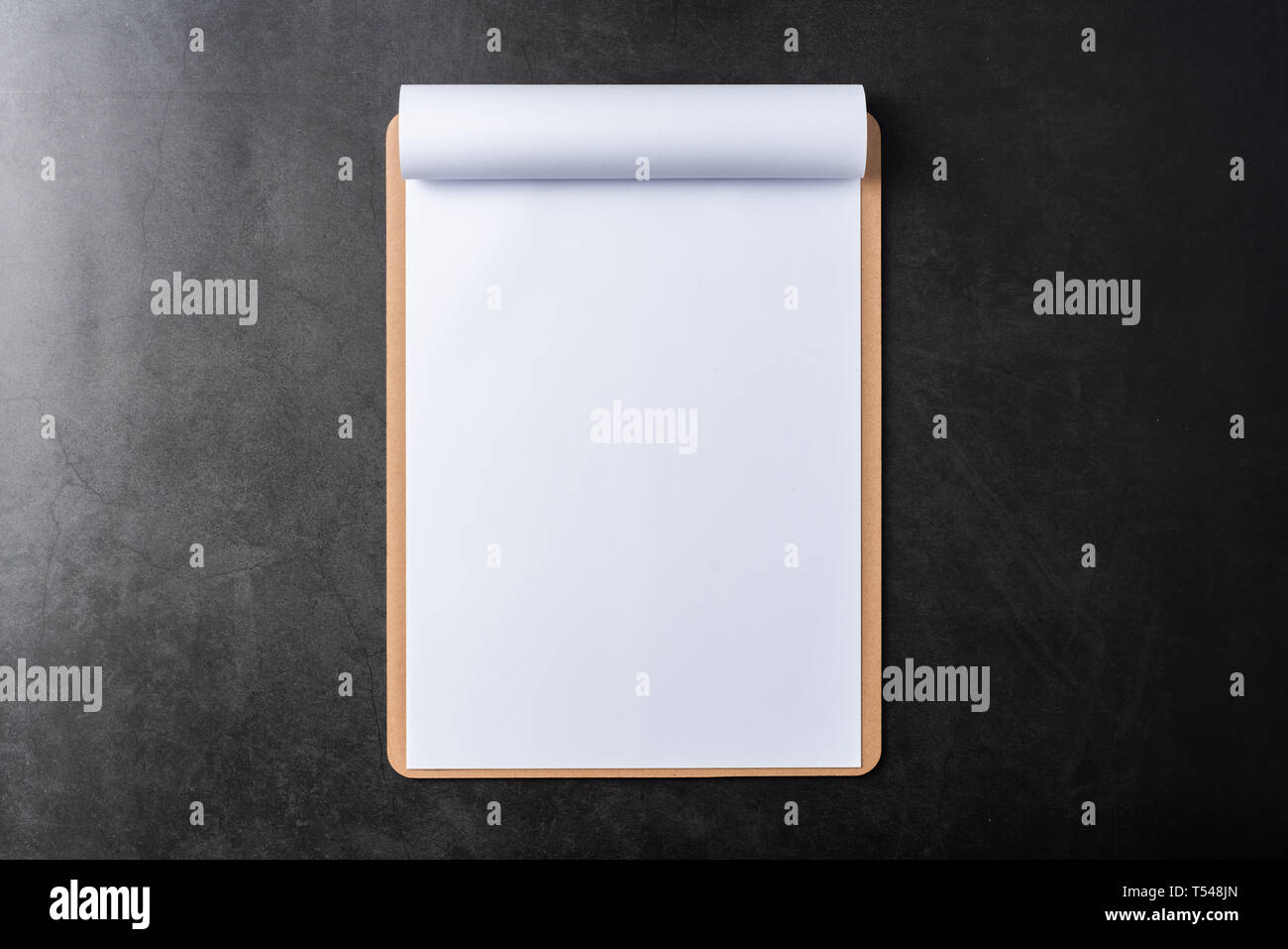 Design concept - top view of white A4 flipped paper with brown ...