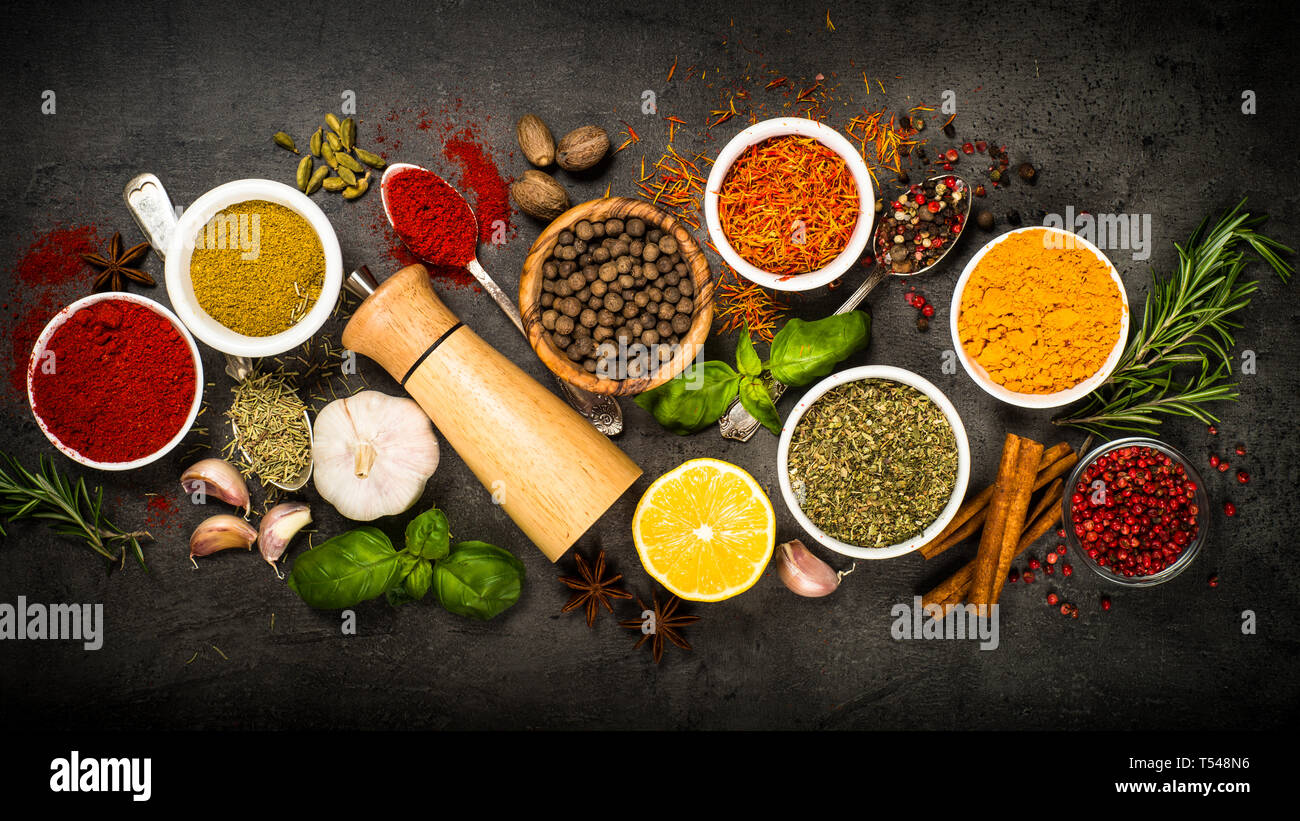 Set of various spices on black background Stock Photo - Alamy