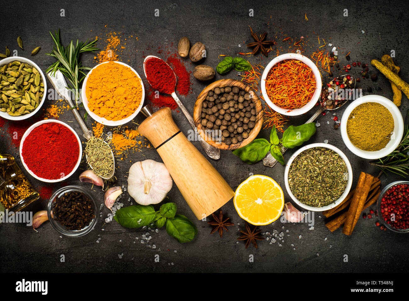 Set of various spices on black background Stock Photo - Alamy
