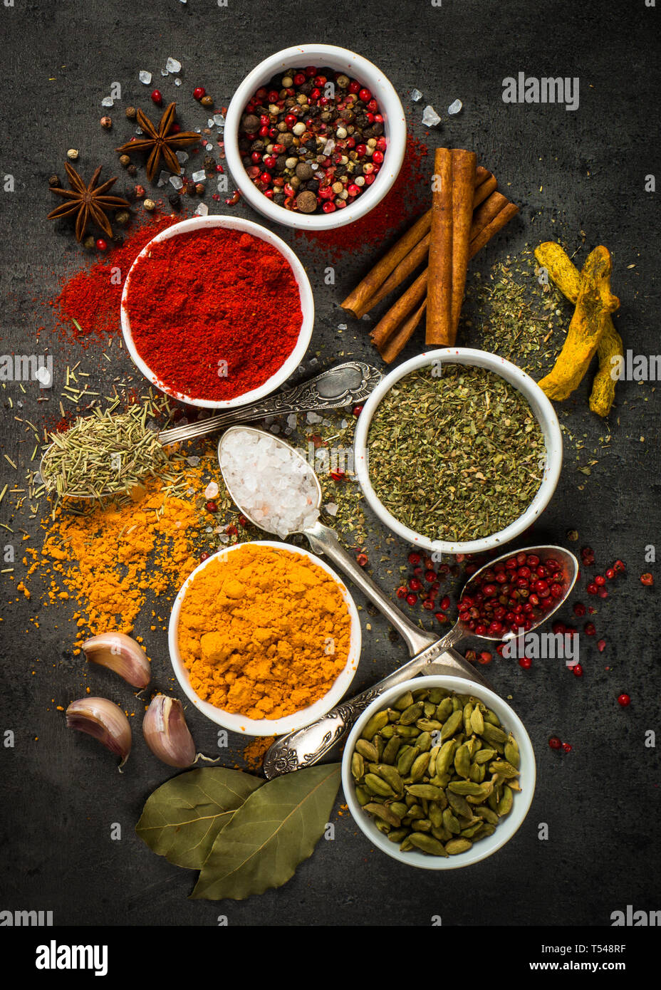 Set of various spices on black background Stock Photo - Alamy