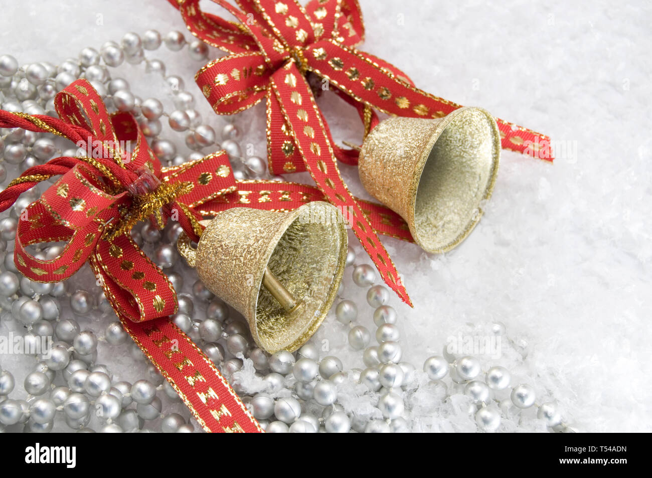 Beautiful Christmas Bells with Red Ribbons and Pearls Stock Photo - Alamy