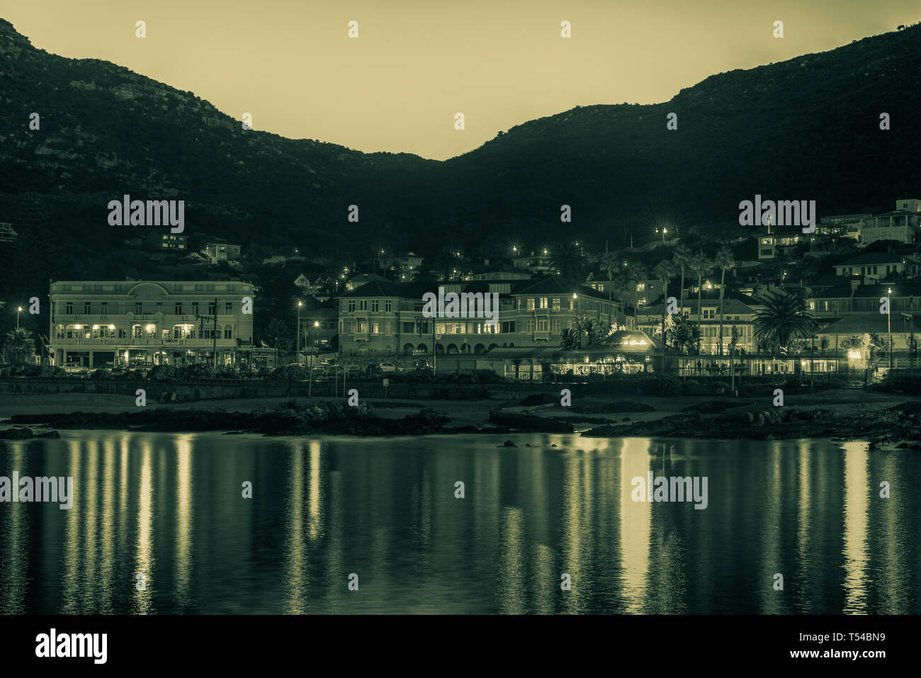 The Cape Peninsula village of Kalk Bay at dusk on the False Bay ...