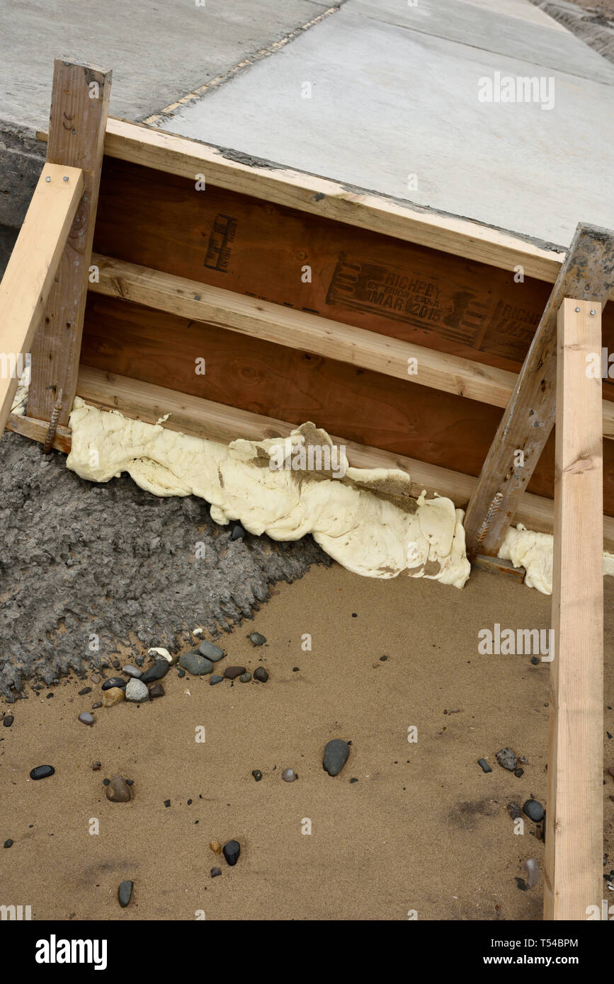 Damaged reinforced concrete sea wall,flood defences repair work with ...
