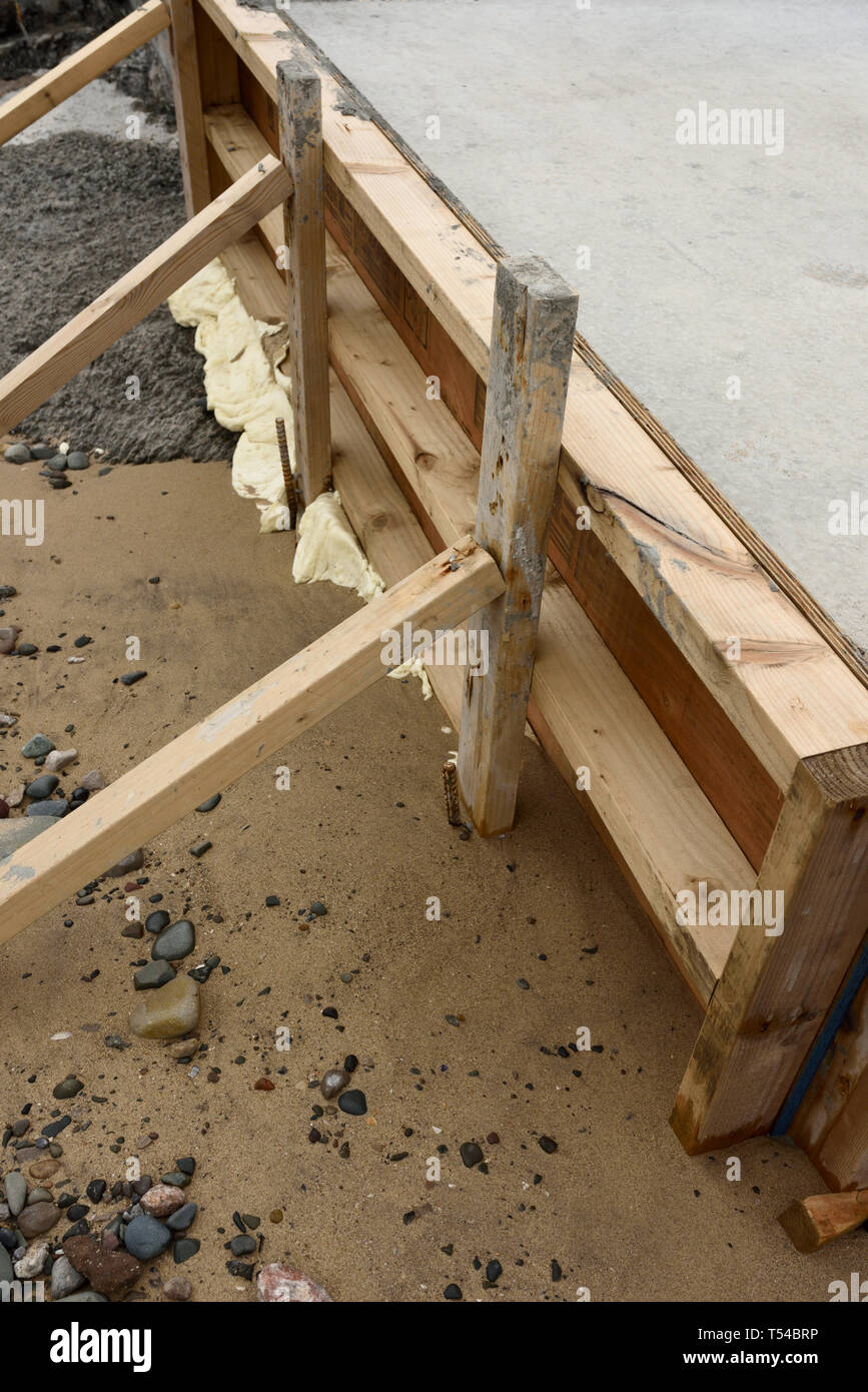 Damaged reinforced concrete sea wall,flood defences repair work with ...