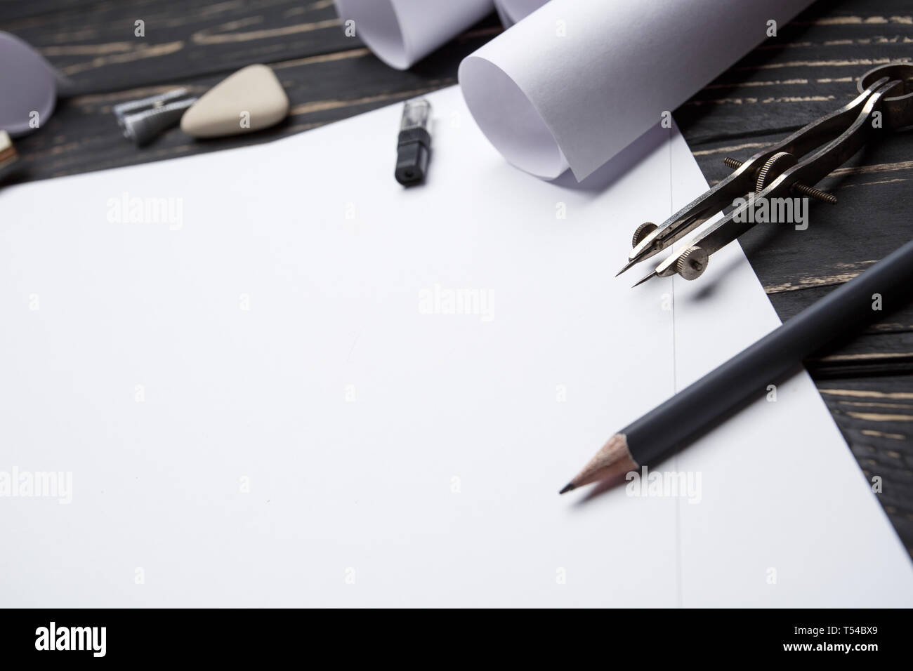 Sit at the table and create your drawing. office workspace with blank ...