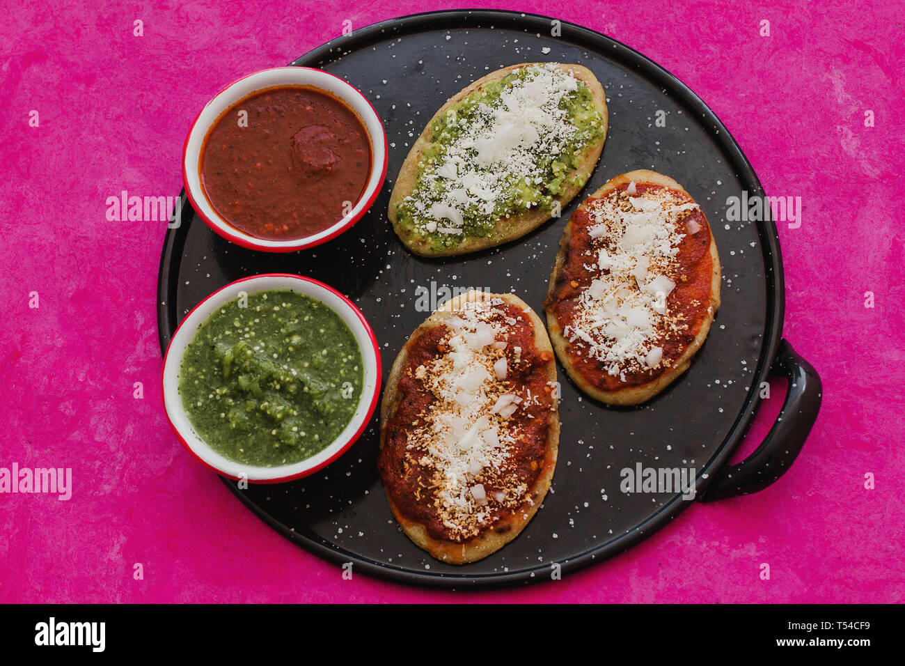 mexican tlacoyos with green and red sauce, Traditional food in Mexico ...