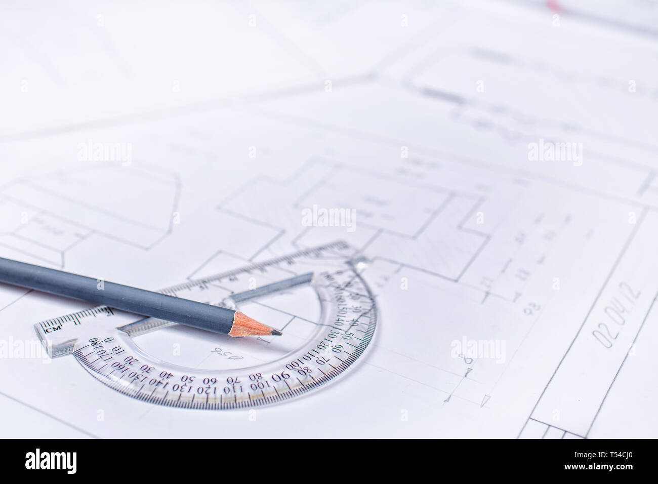 Gray pencil with a protractor in the drawings. Design and working ...