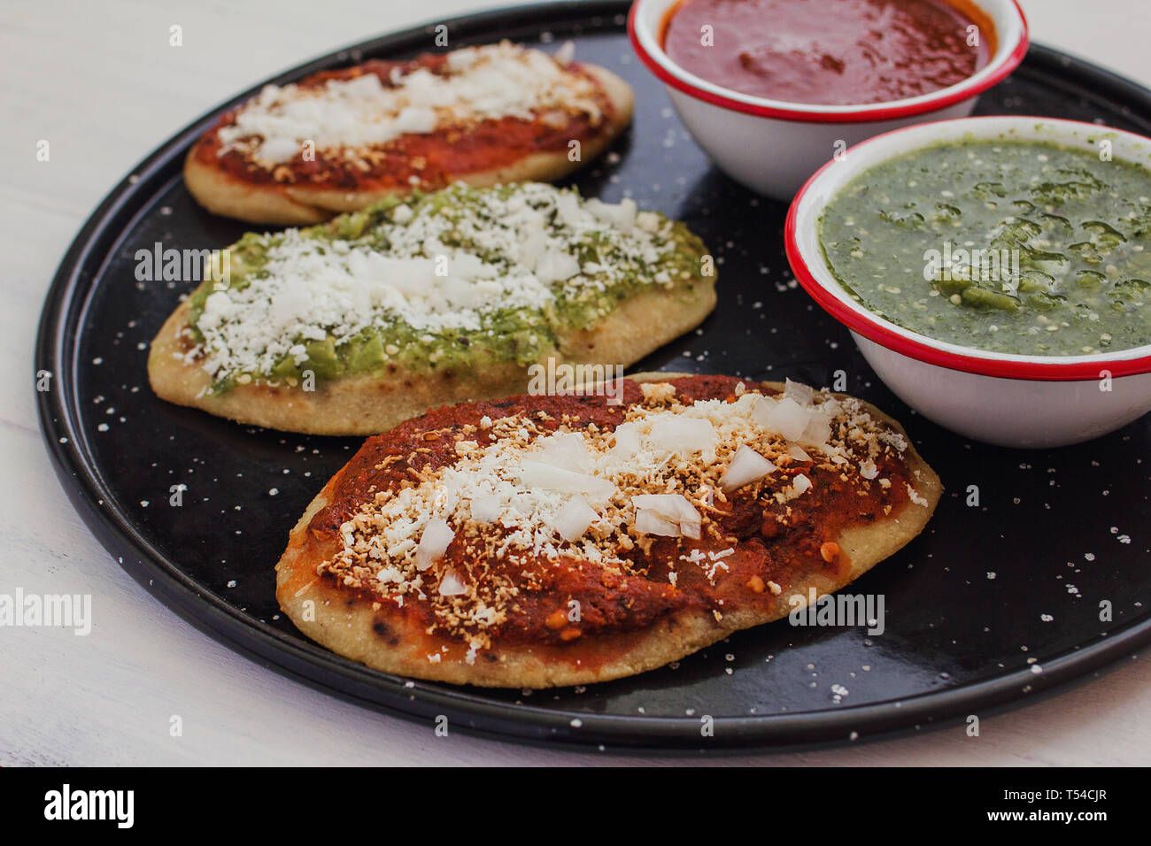 mexican tlacoyos with green and red sauce, Traditional food in Mexico ...