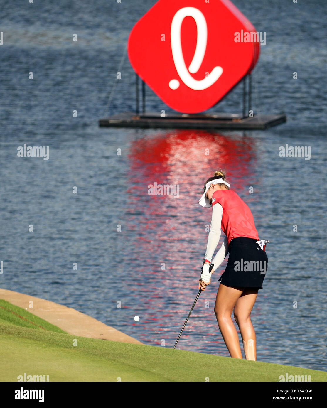 Hawaii, USA. 20th Apr, 2019. Nelly Korda chips onto the 18th green ...