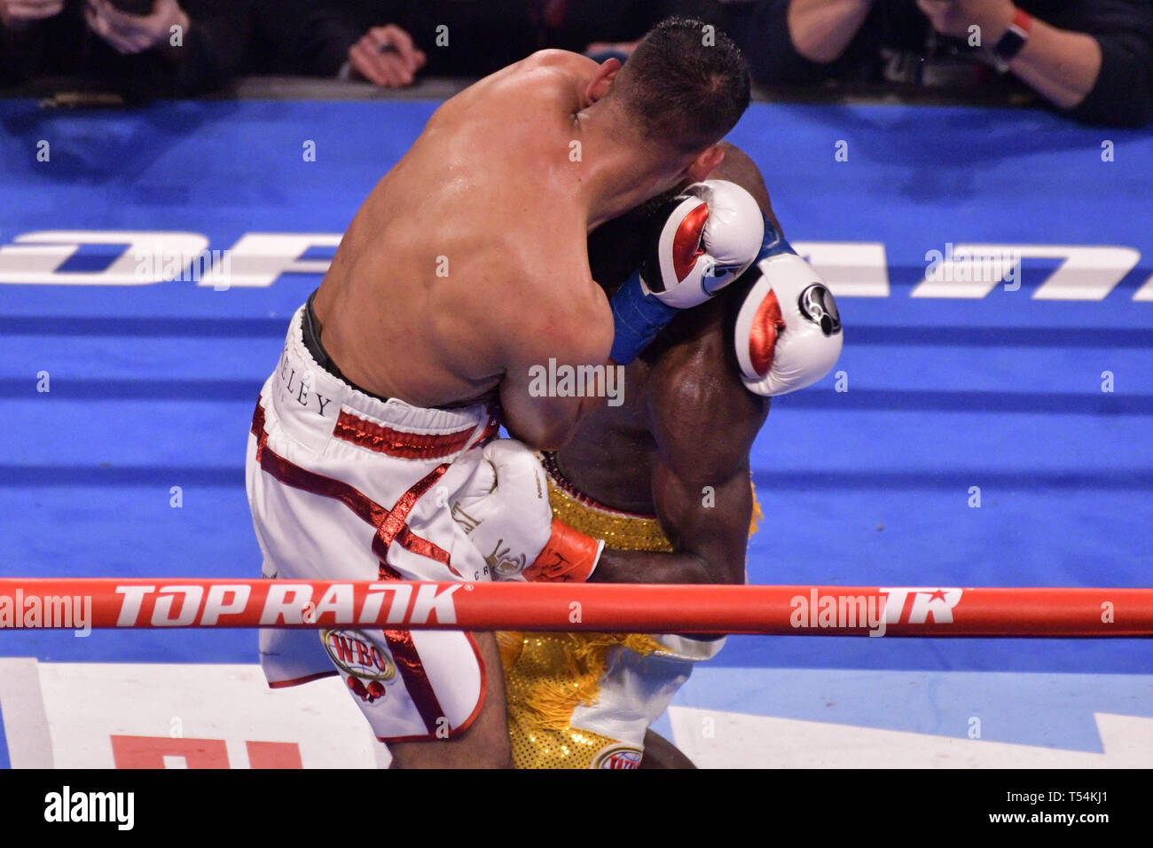 New York, USA. 21st Apr, 2019. TERENCE CRAWFORD (yellow trunks) hits ...