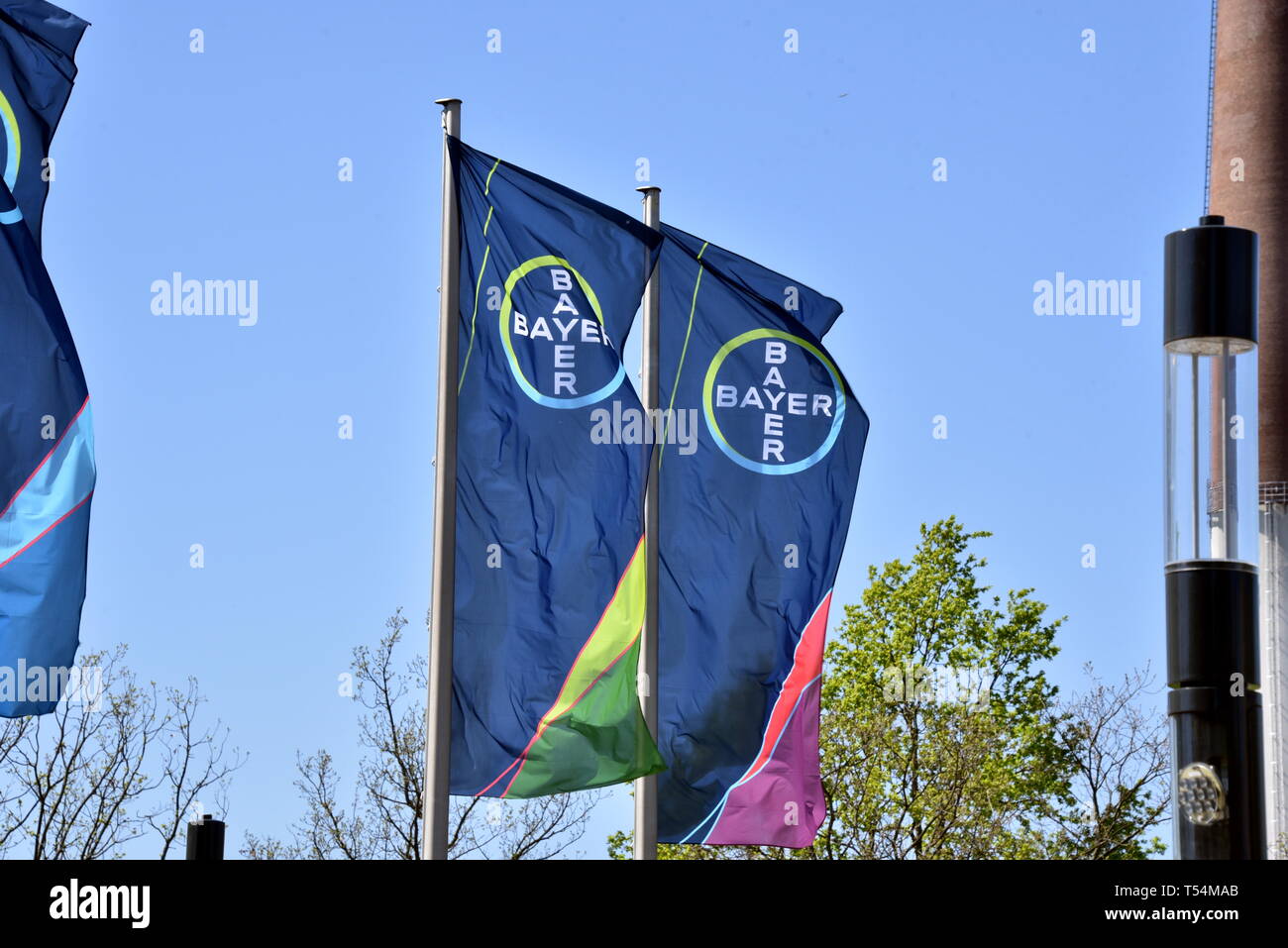 Leverkusen, Germany. 19th Apr, 2019. Flags with the logo of Bayer AG, a ...