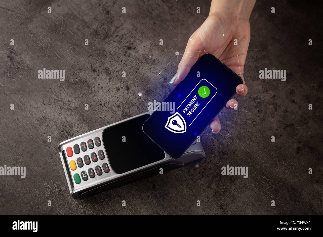 Hand paying on terminal with smartphone in secure payment system Stock ...
