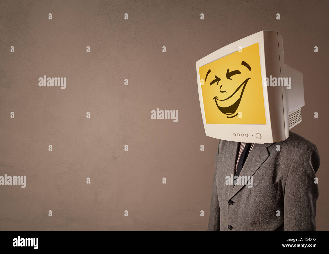 Young person with happy smiley monitor head Stock Photo - Alamy