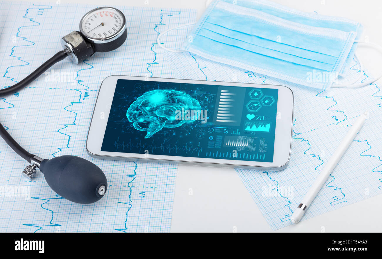 Brain functionality report with medical devices around Stock Photo - Alamy