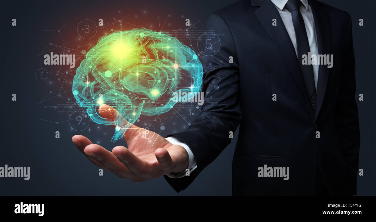 Businessman holding human brain on his hand with logistics symbols ...