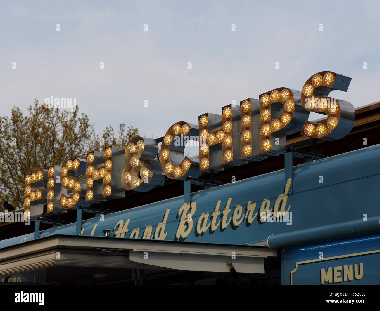 Fish & Chips sign above van Stock Photo - Alamy