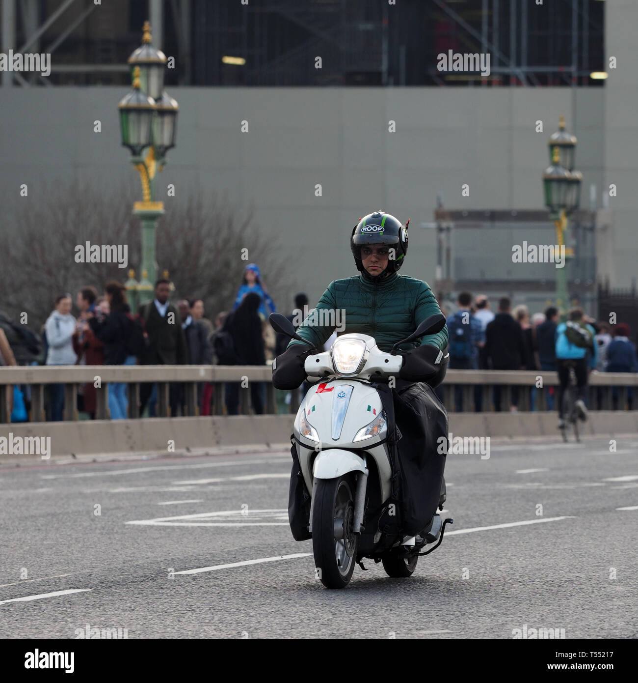 Commuting by moped scooter in London, England. UK Stock Photo - Alamy