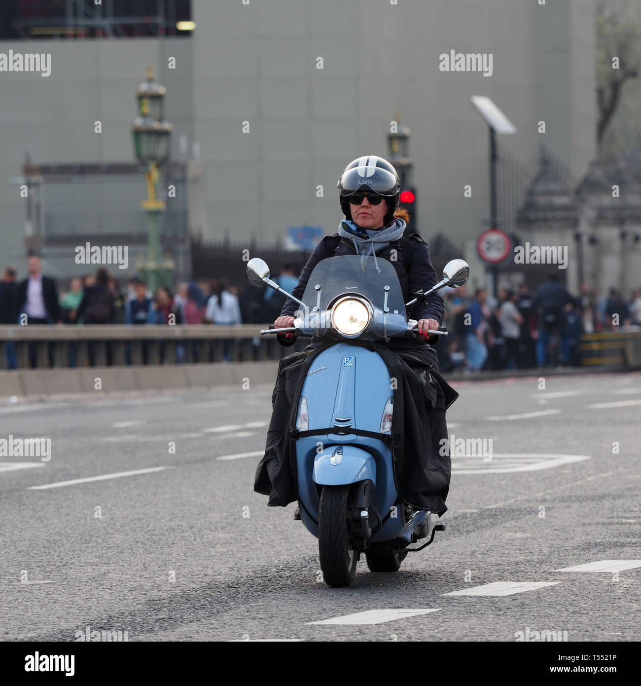 Commuting by moped scooter in London, England. UK Stock Photo - Alamy