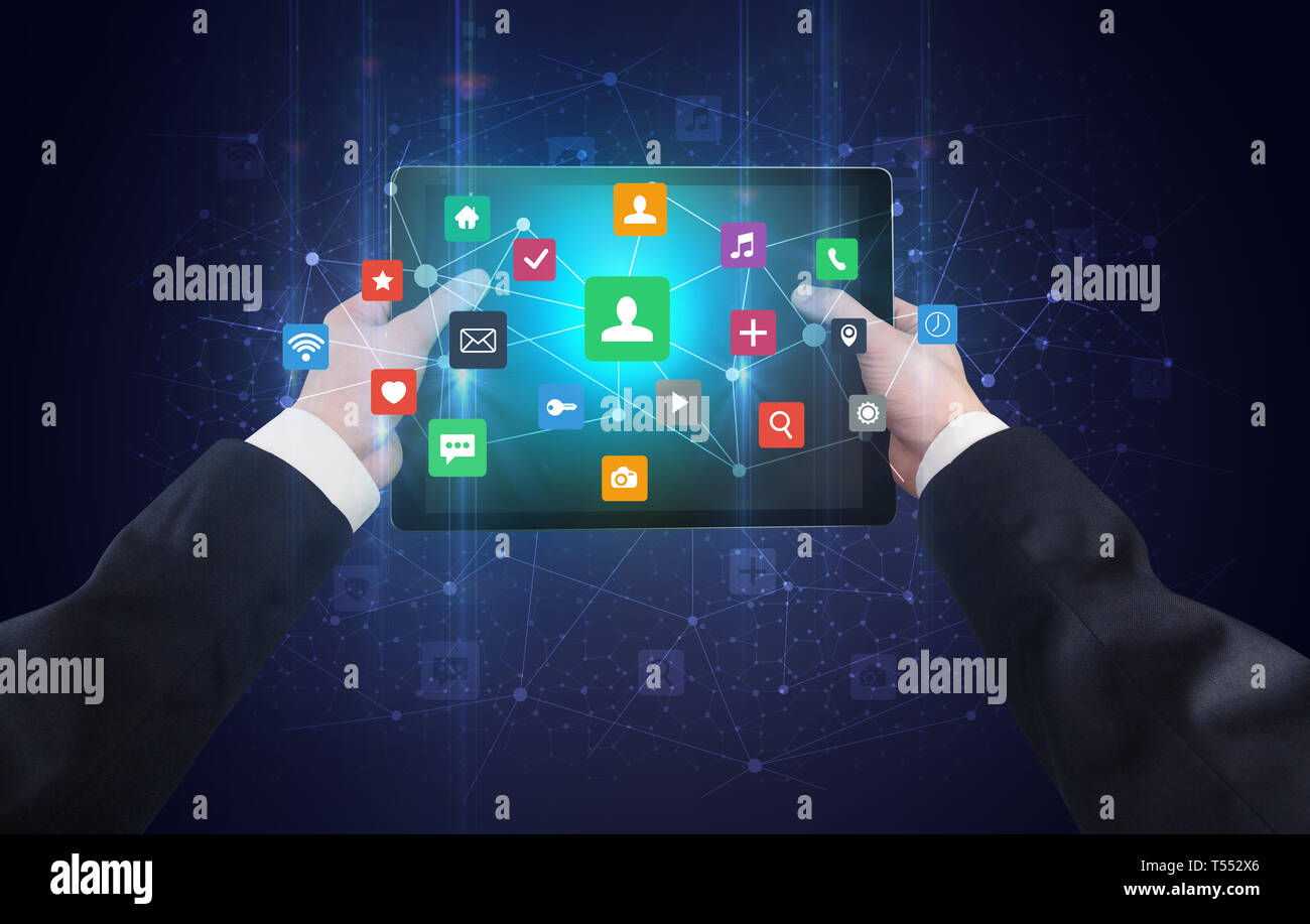Hand using tablet with colorful bounce application symbols and icons ...