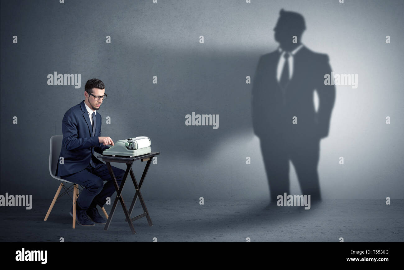 Shadow threatening hard worker man who is afraid Stock Photo - Alamy