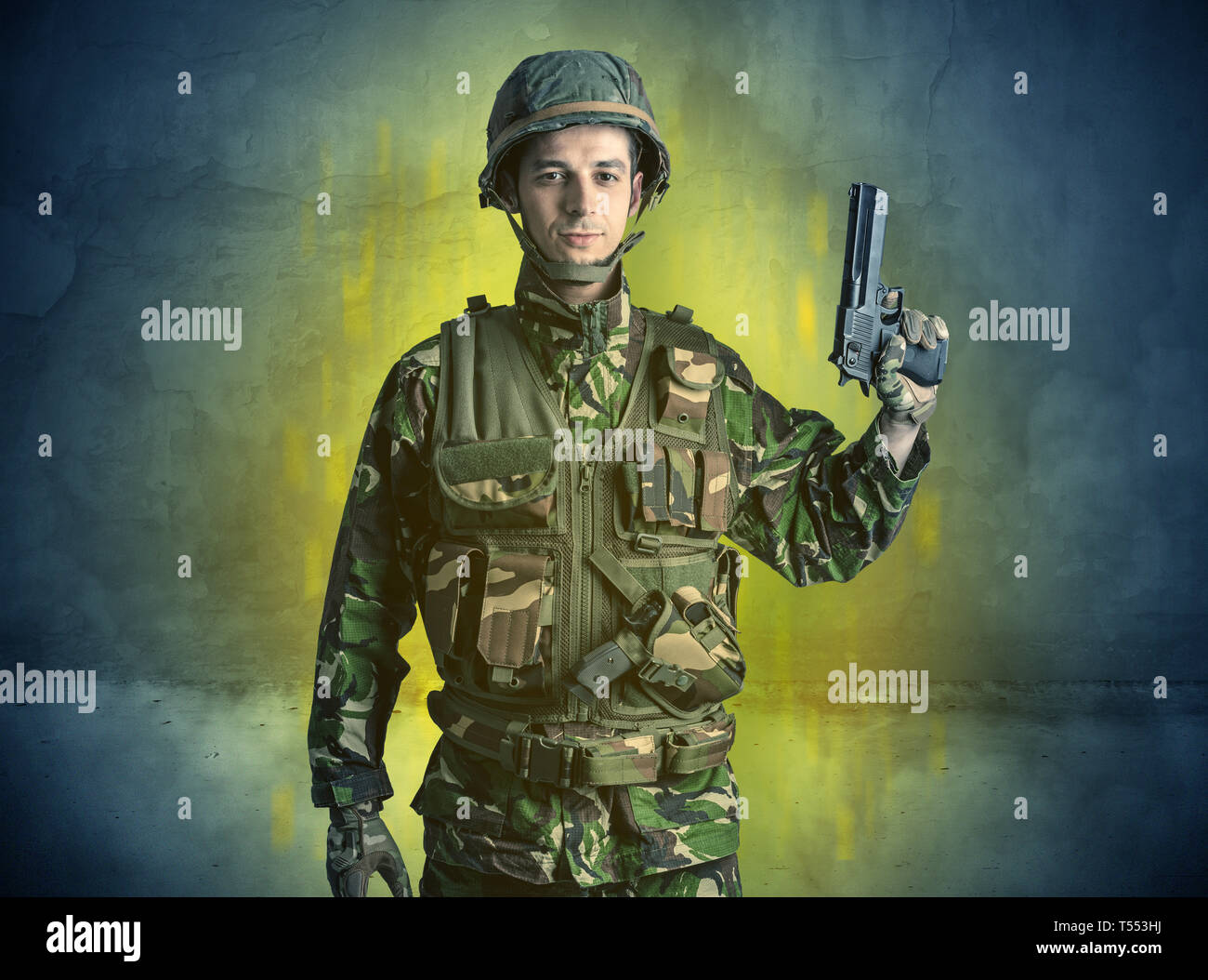 Hazard, menace soldier in a ruined crumbly building with arms on his ...