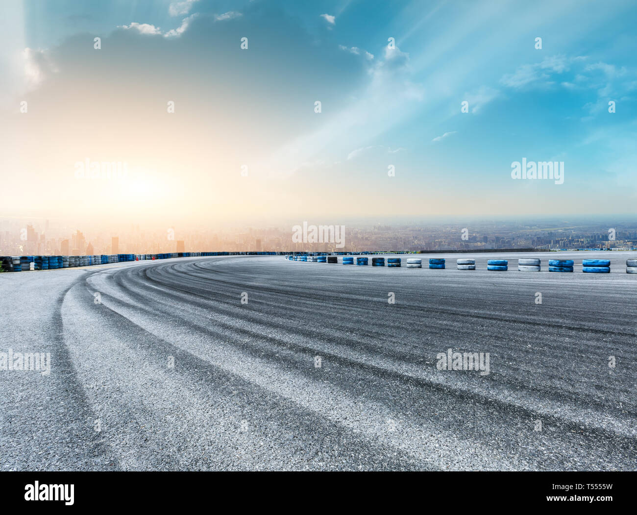 Shanghai city skyline and asphalt race track ground at sunrise,high ...