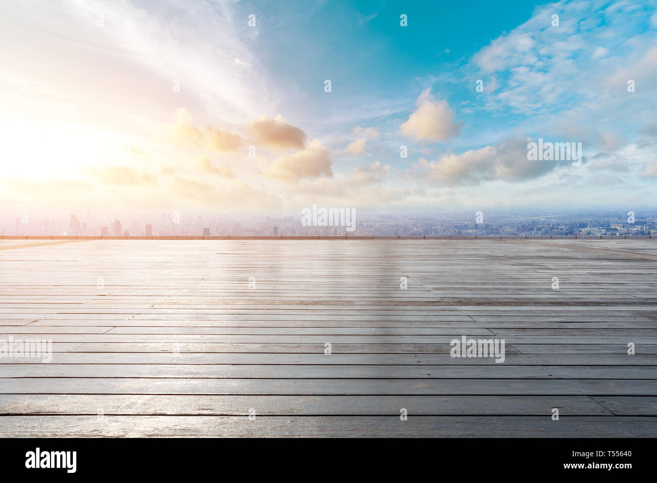 Shanghai city skyline and wooden platform with beautiful clouds at ...