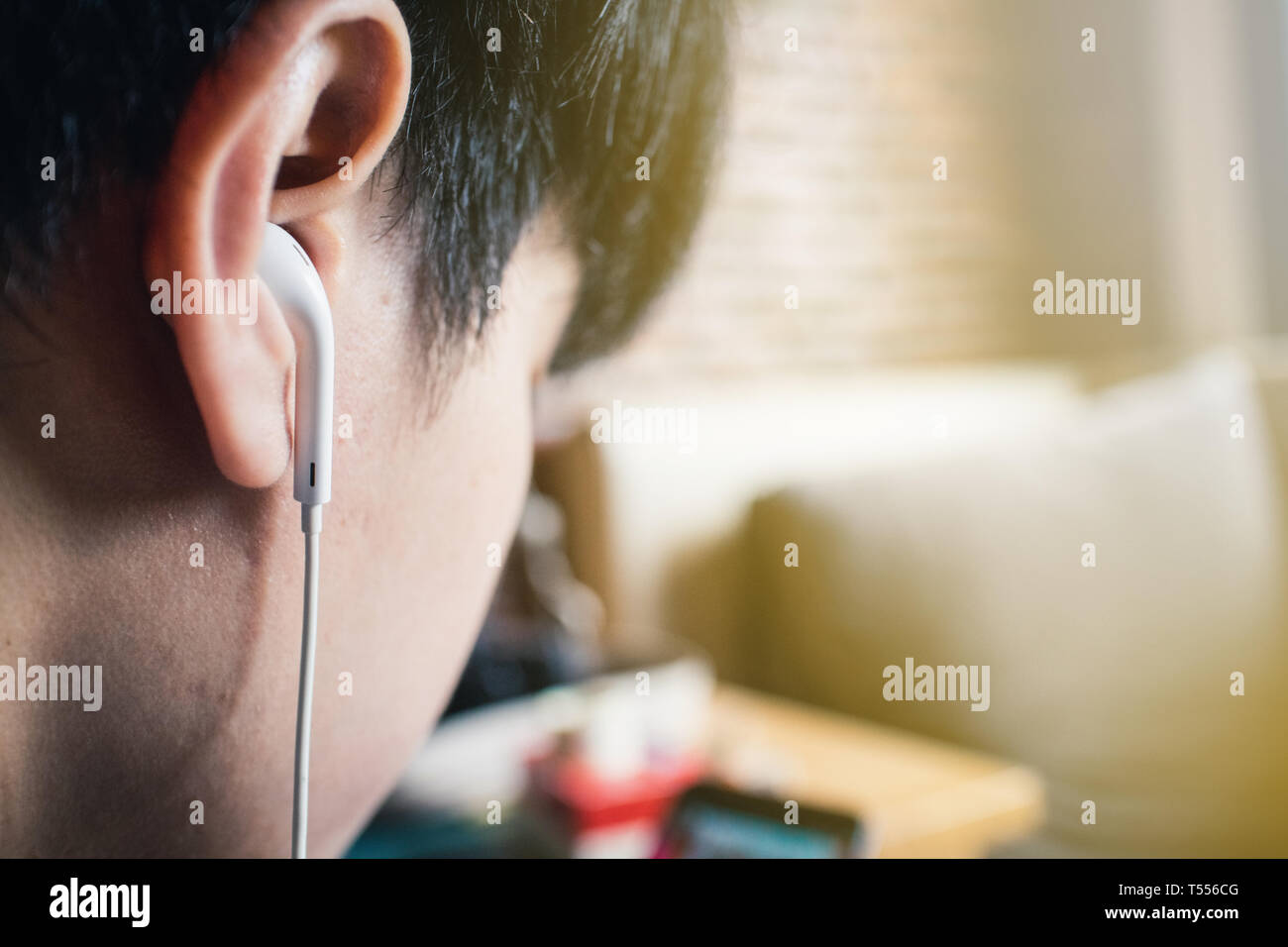 man wearing earphones Stock Photo - Alamy