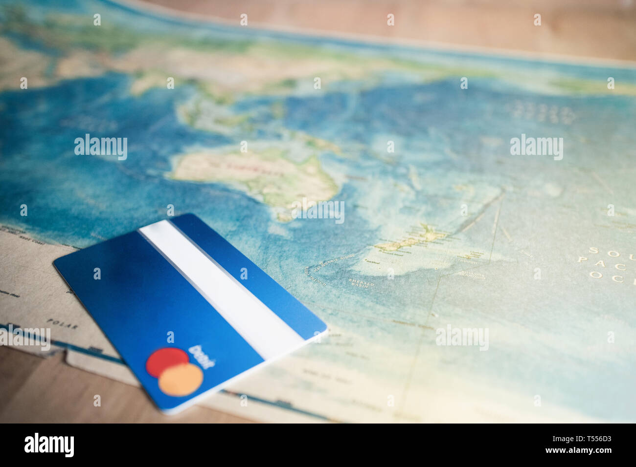 Credit card on world map Stock Photo - Alamy