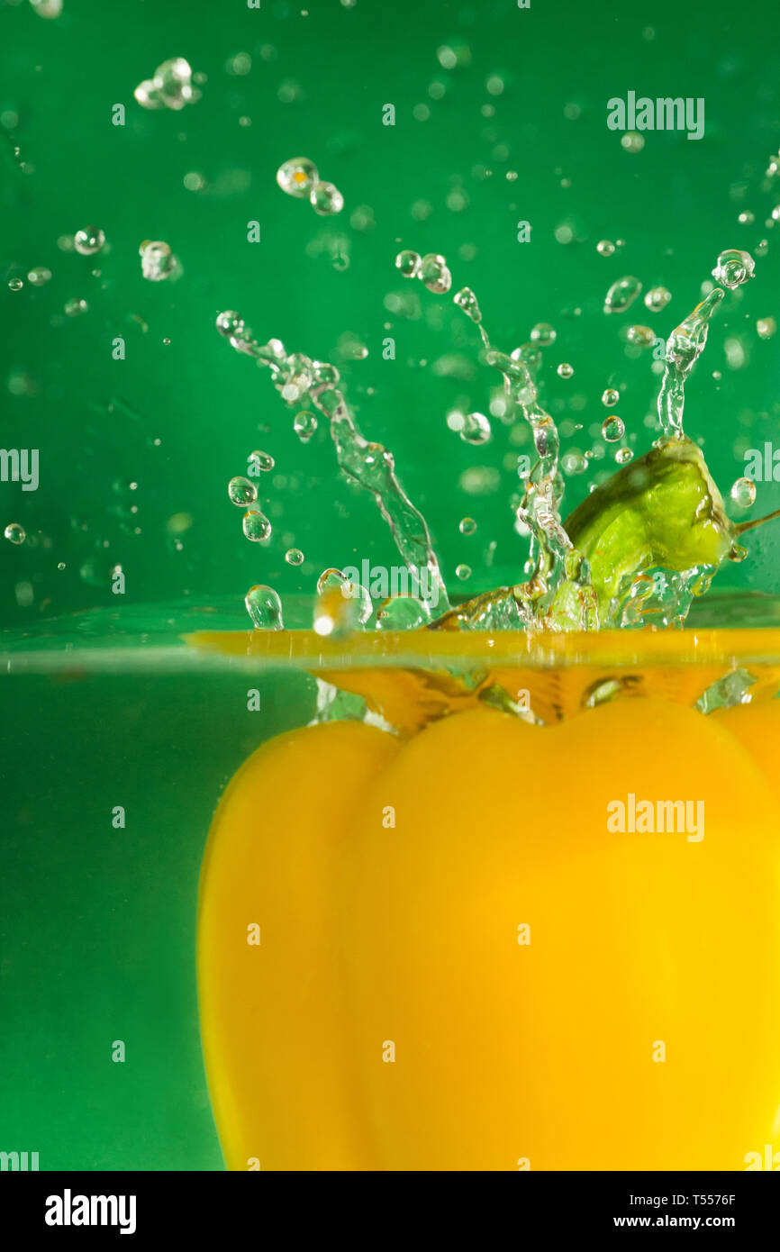 colorful sweet pepper drops in water Stock Photo - Alamy
