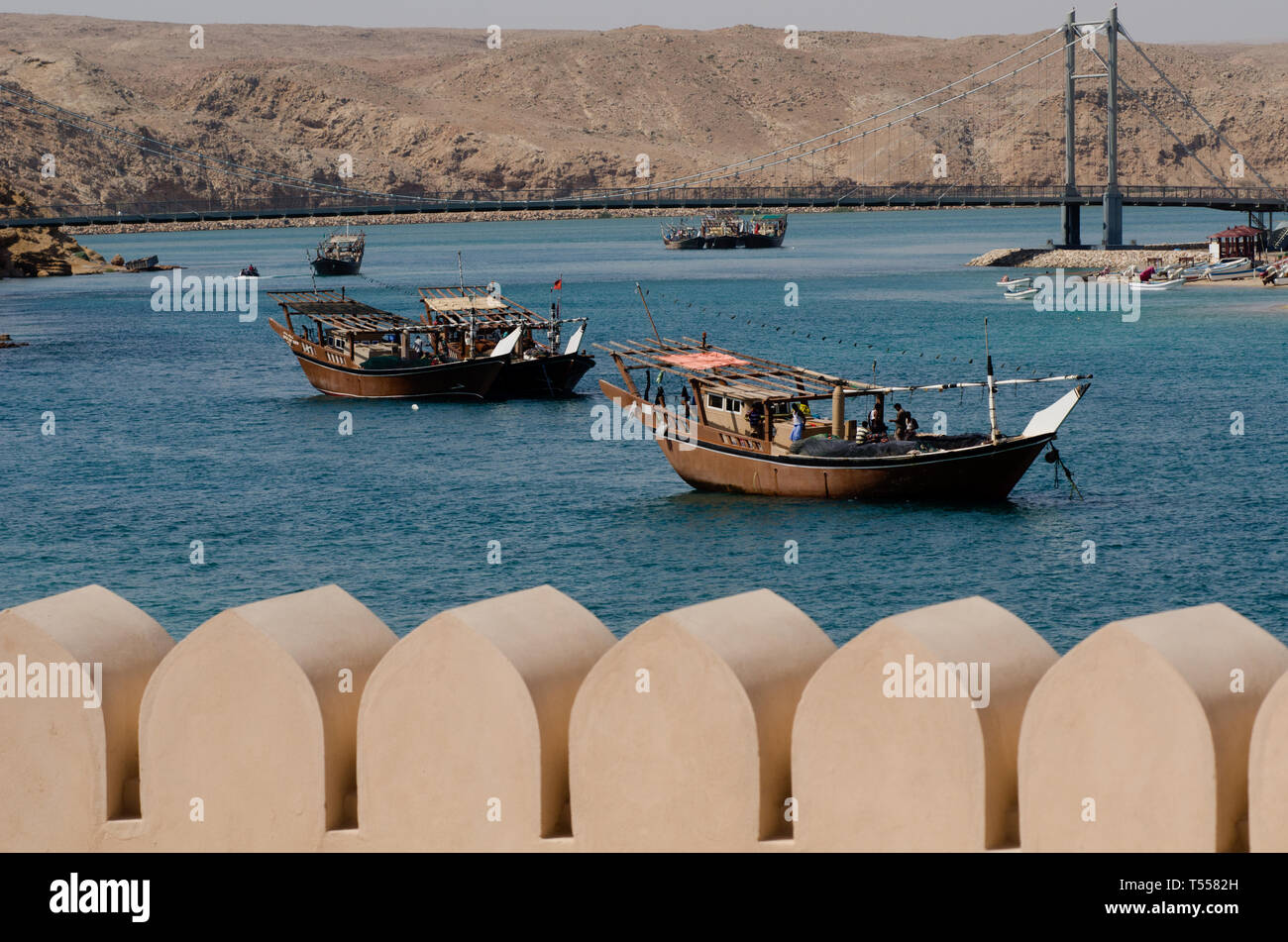 Traditional Omani Dhows anchored in the historic harbor of Sur on the ...