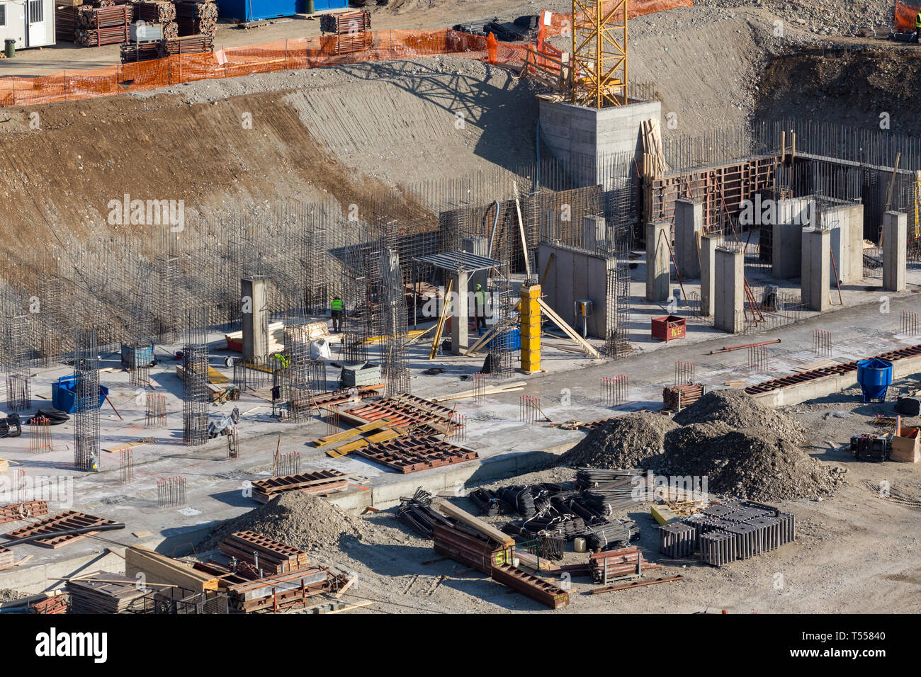 Construction of the building. Workers unrecognizable make metal ...