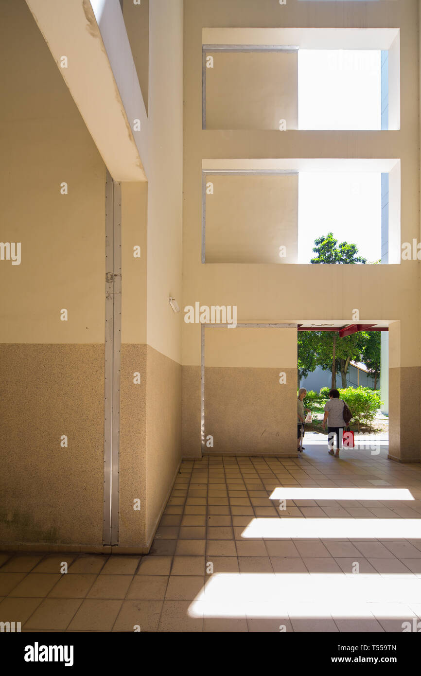 Interior of a block with lights falling on the ground Stock Photo - Alamy