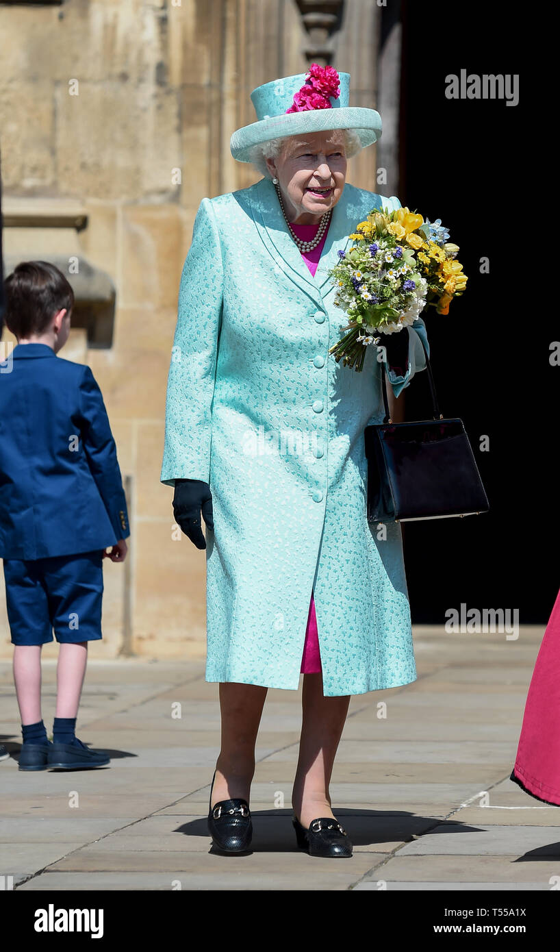 Queen Elizabeth II is presented with flowers as she leaves the Easter ...
